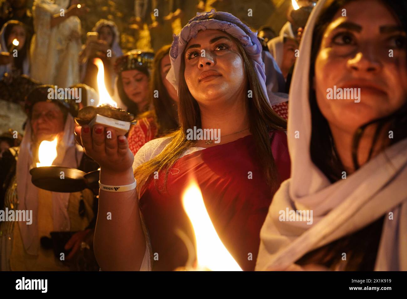 Iraqi Yazidi women light candles at Lalish mountain valley and temple ...