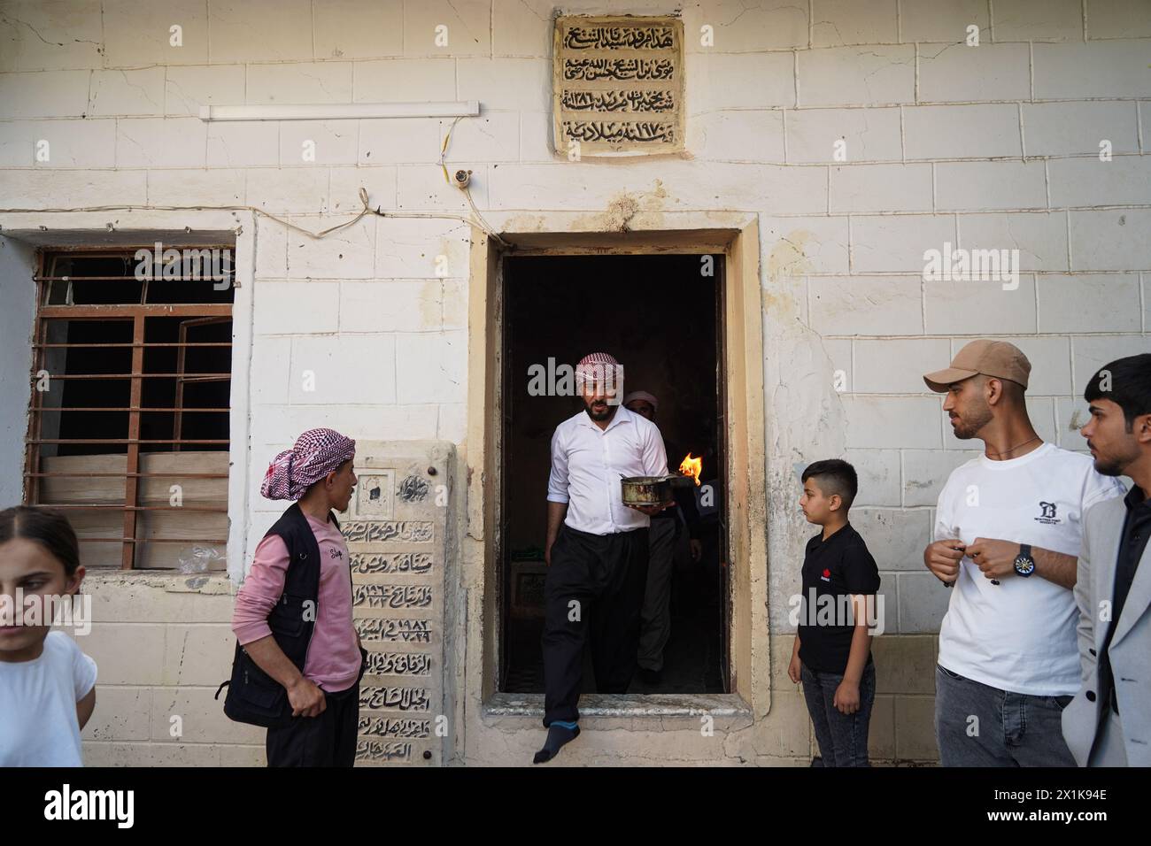 Iraqi Yazidi man light candles at Lalish mountain valley and temple ...