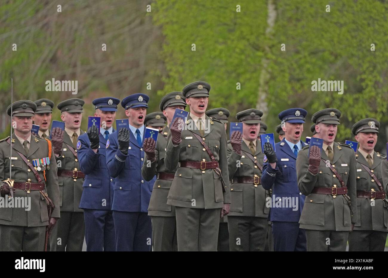 Cadets holding the Bible during the commissioning ceremony of the 99th ...