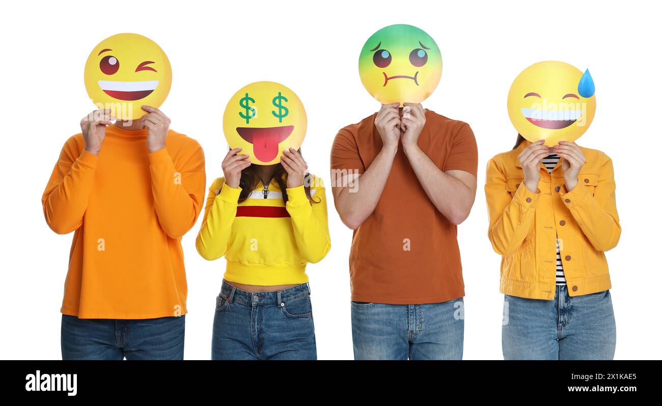 People covering faces with emoticons on white background Stock Photo ...