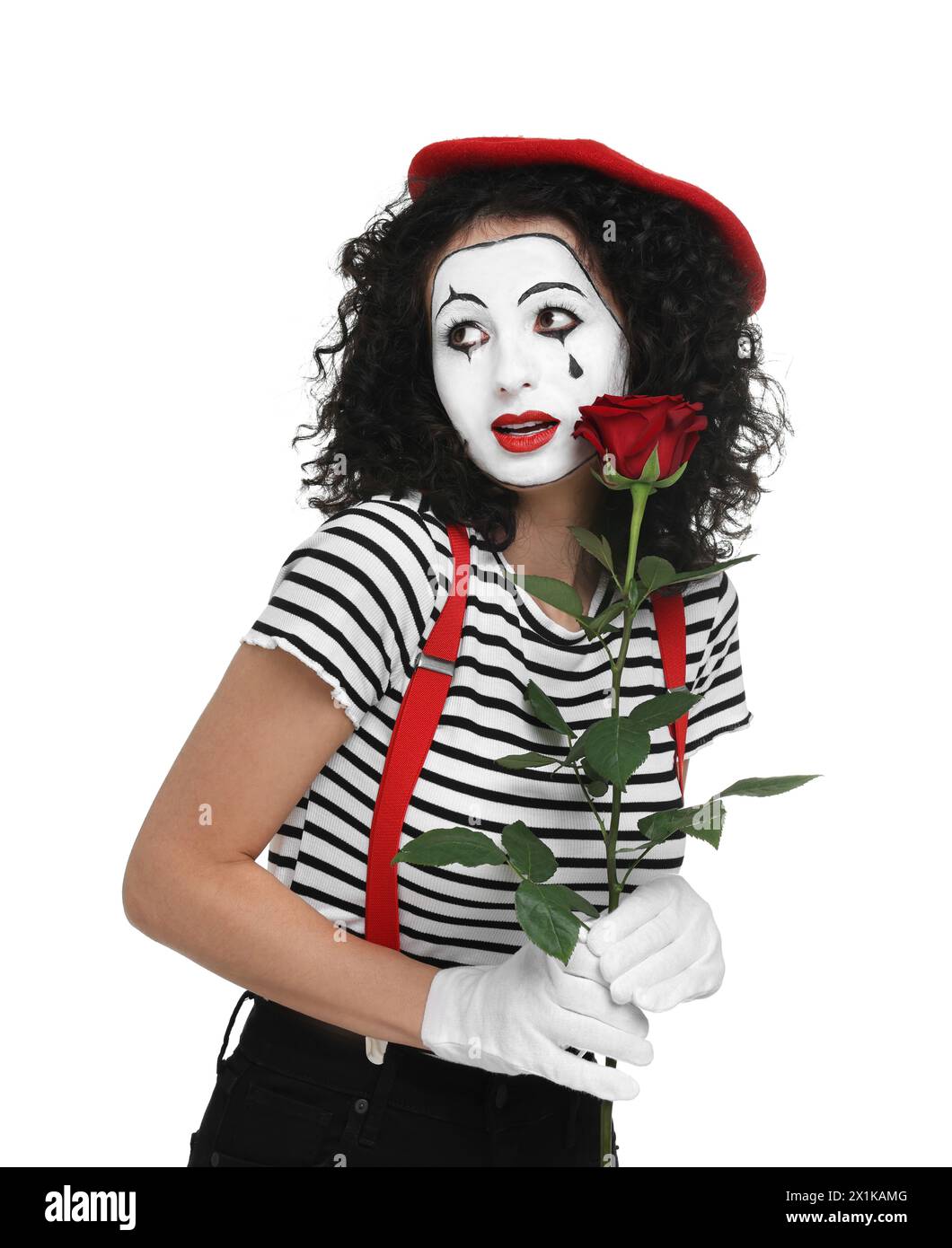 Funny mime with red rose posing on white background Stock Photo - Alamy