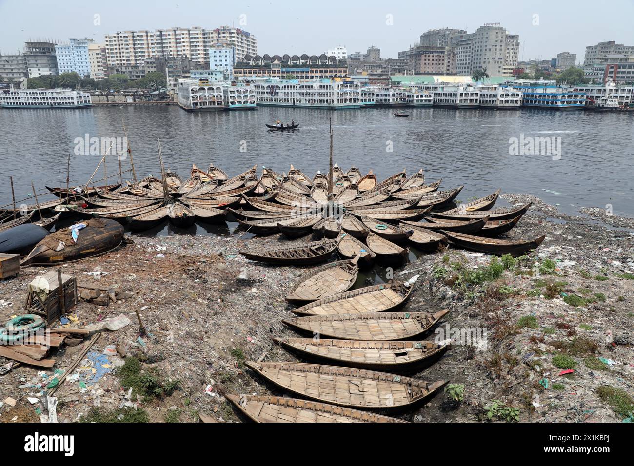 DHAKA, BANGLADESH - APRIL 16: Empty Boats float parked in the banks of ...