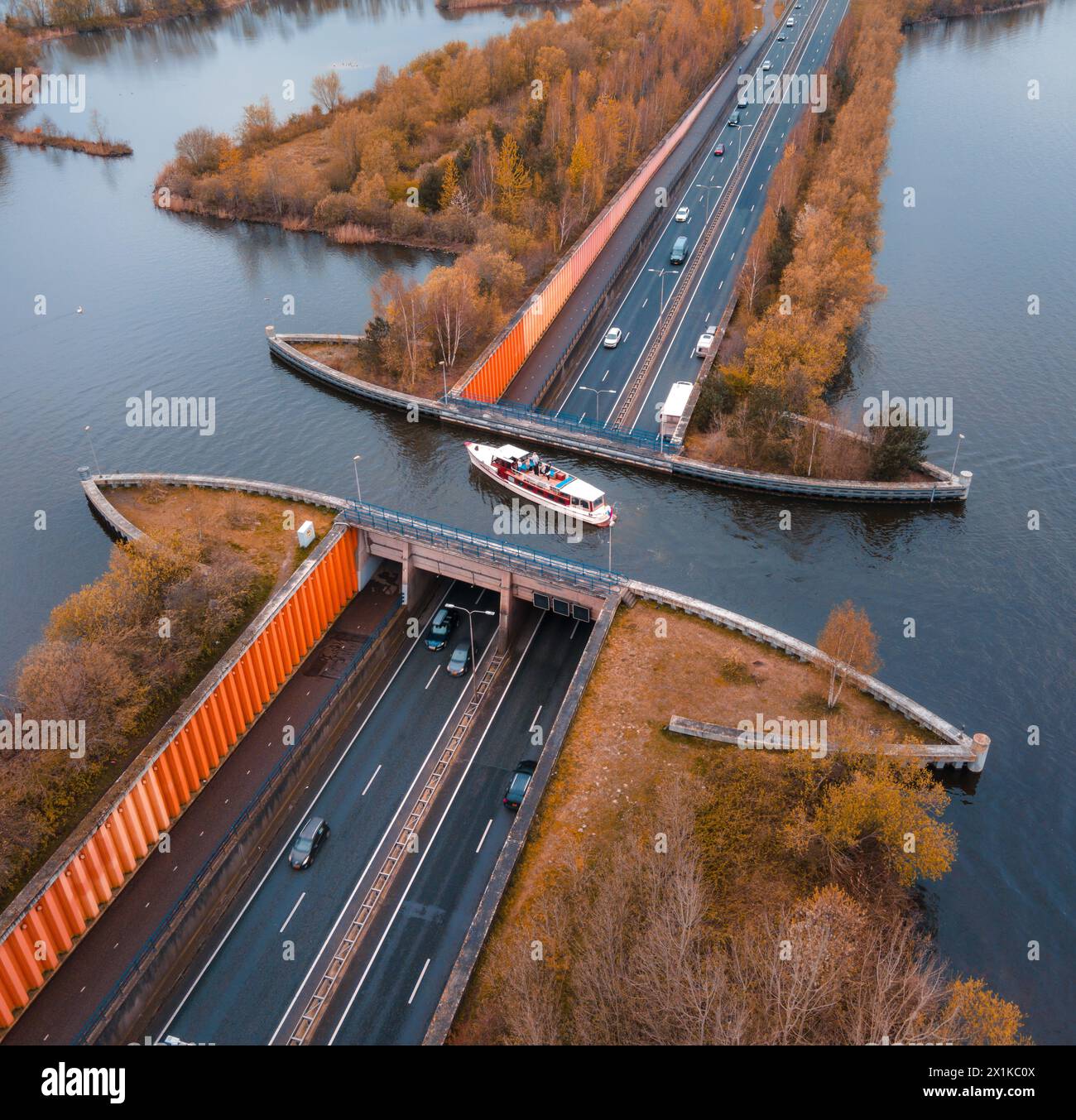 Aquaduct Veluwemeer in the Netherlands, boat passing over the highway ...