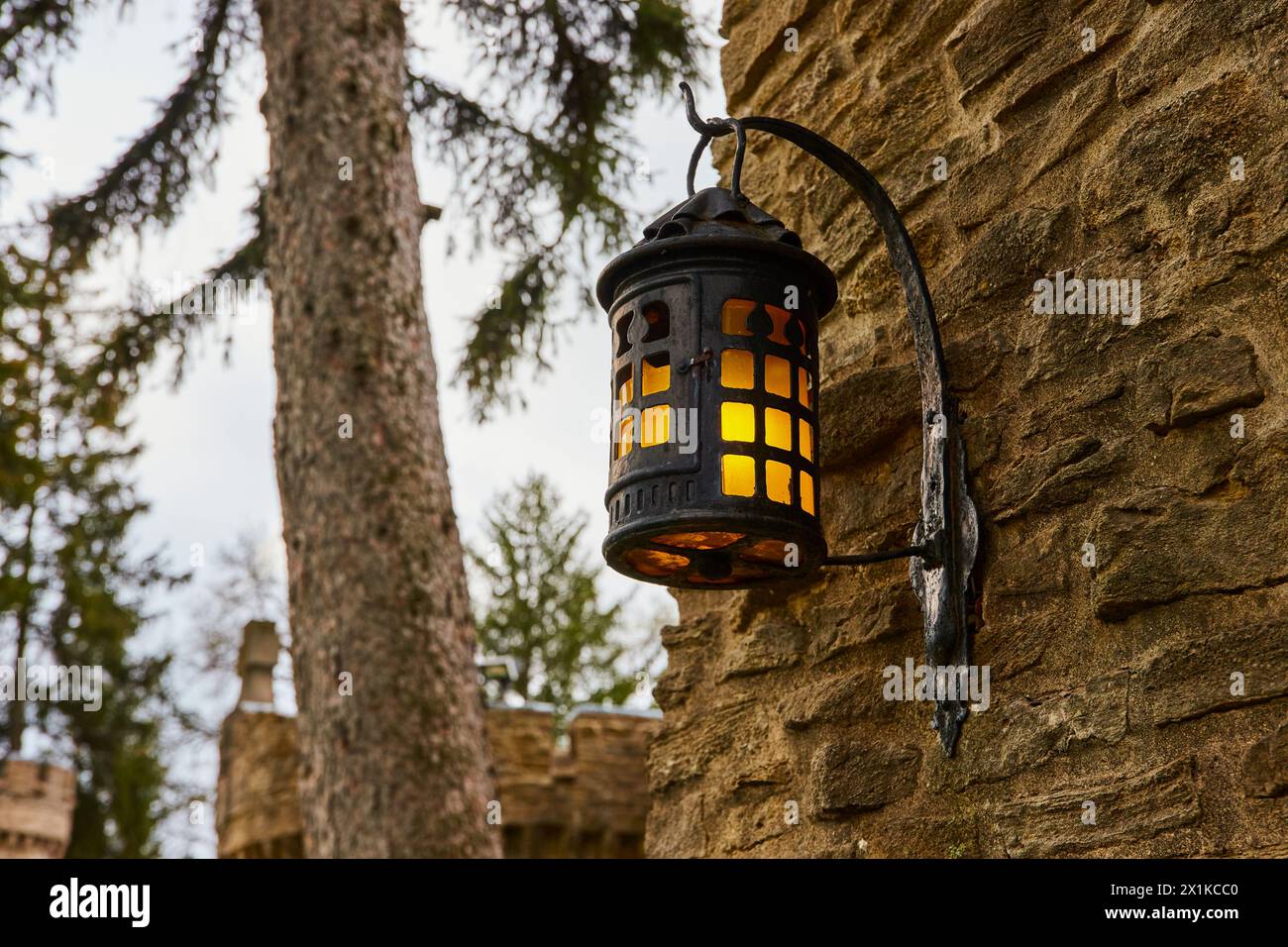 Vintage Lantern Glow on Stone Wall at Historical College Stock Photo ...