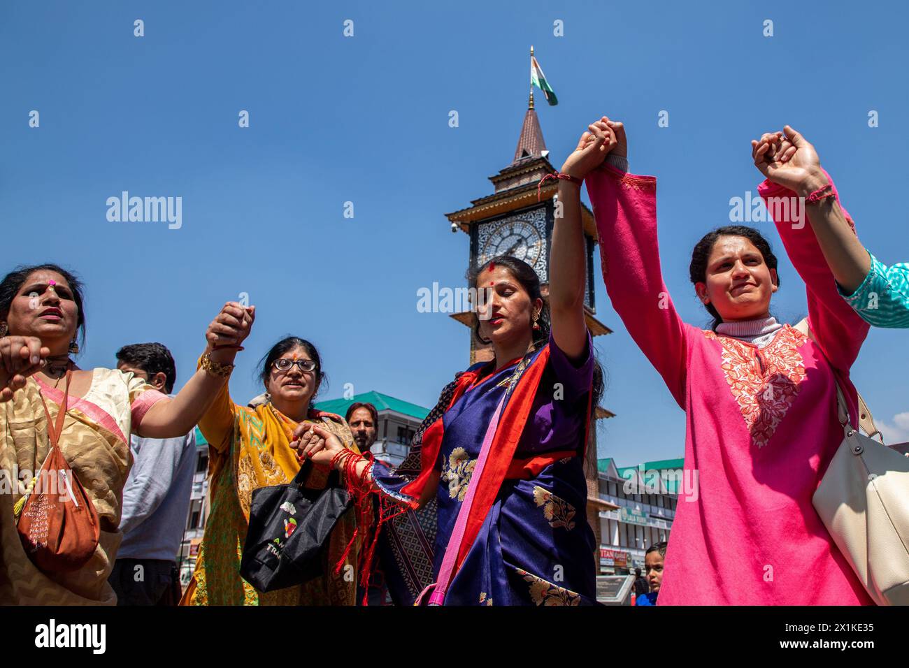 Srinagar, India. 17th Apr, 2024. Hindu devotees dance during a religious procession to celebrate ...