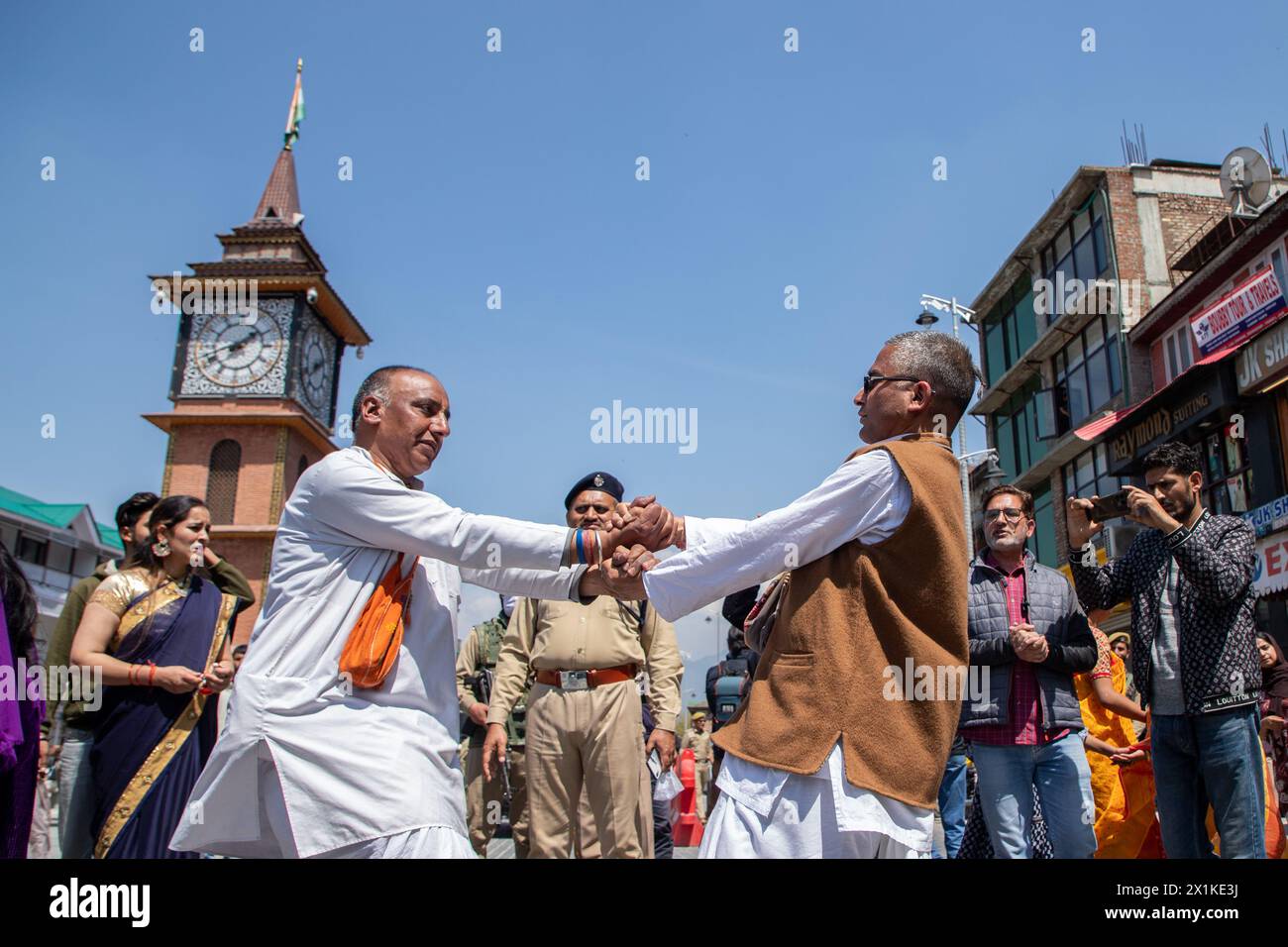 Srinagar, India. 17th Apr, 2024. Hindu devotees dance during a religious procession to celebrate ...