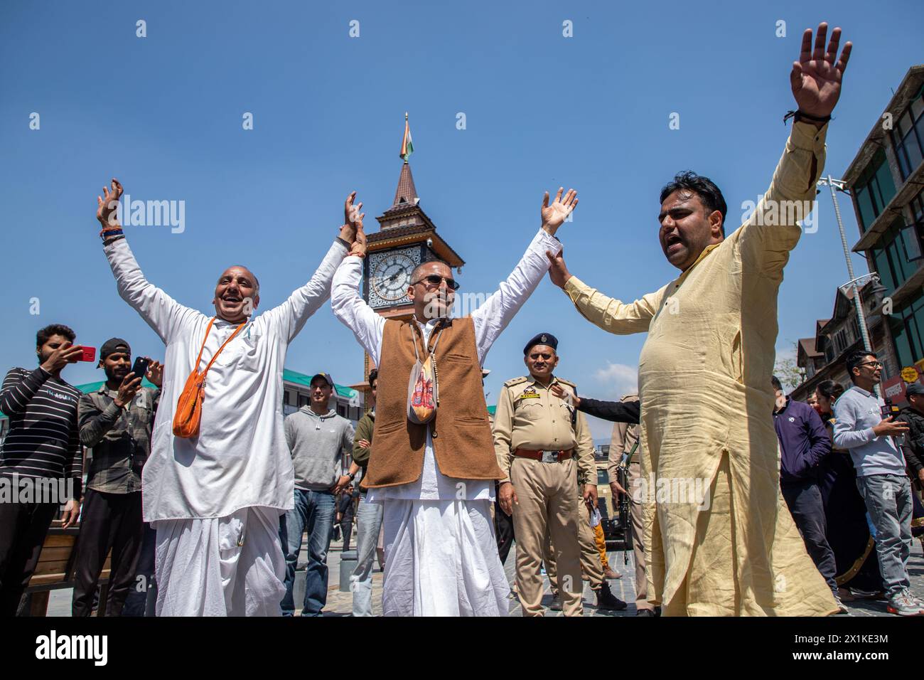 Srinagar, India. 17th Apr, 2024. Hindu devotees dance during a religious procession to celebrate ...