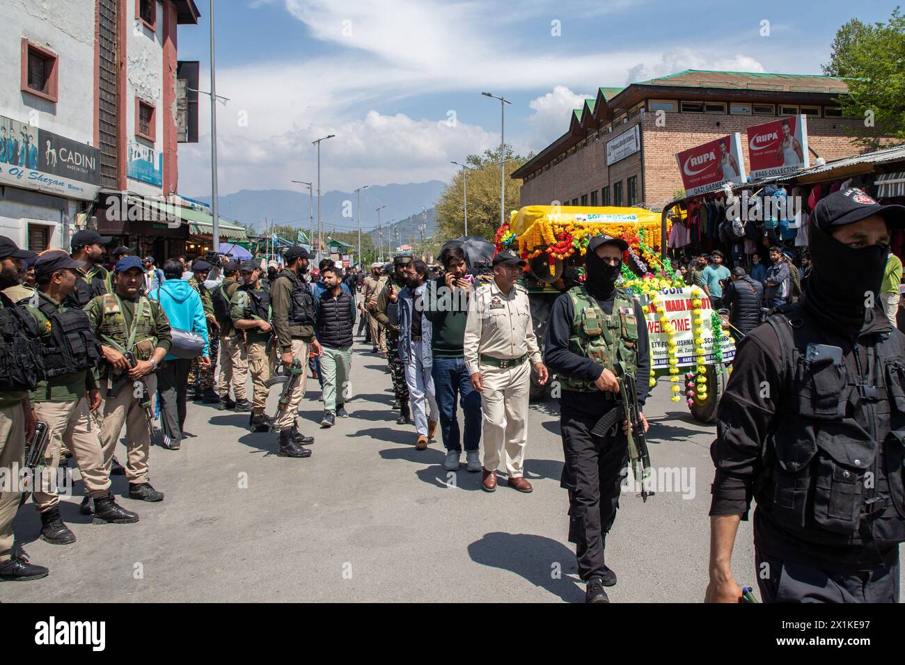 Srinagar, India. 17th Apr, 2024. Indian paramilitary troopers stand on guard as Hindu devotees ...