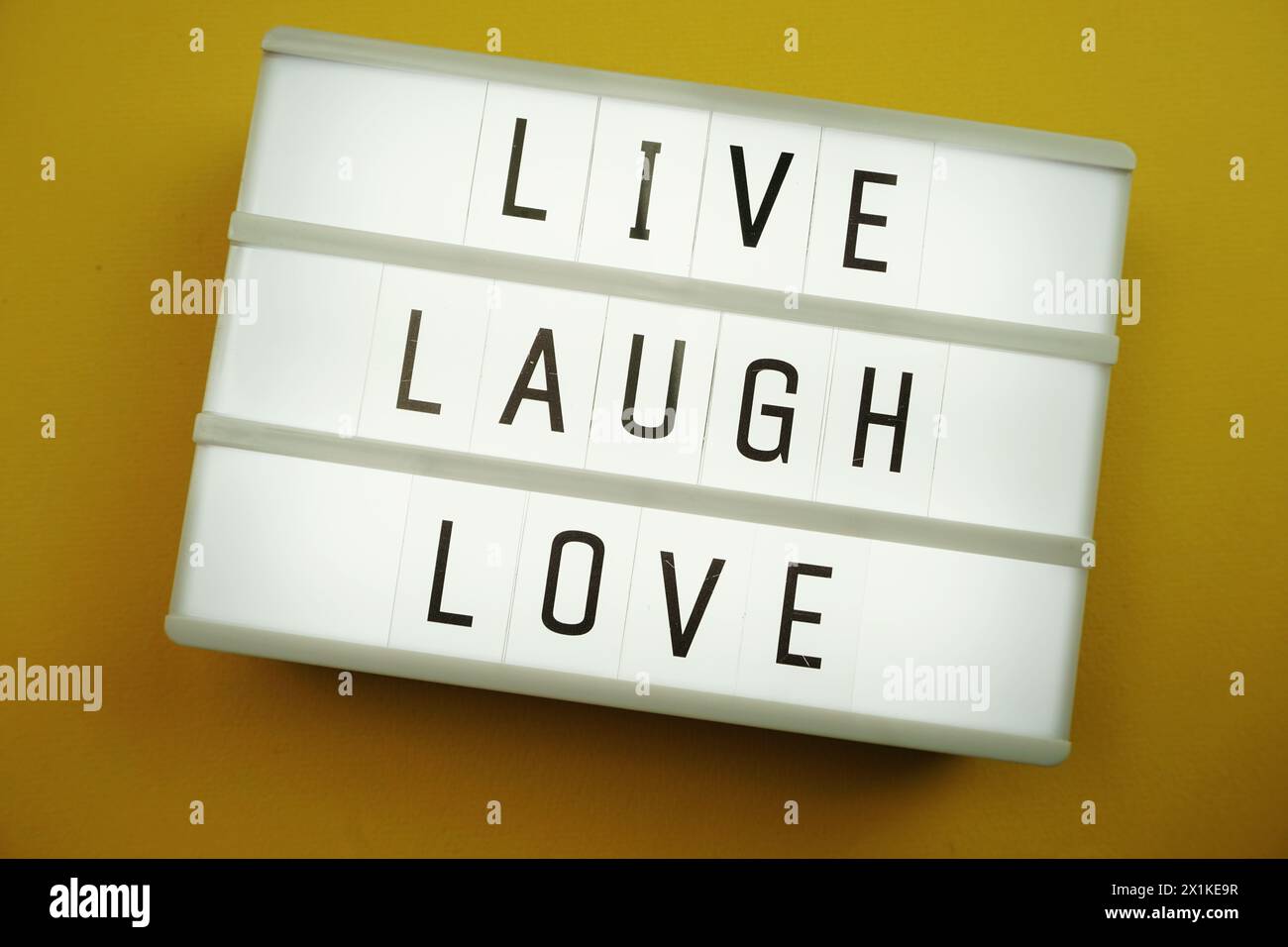 Live Laugh Love word in light box Stock Photo - Alamy