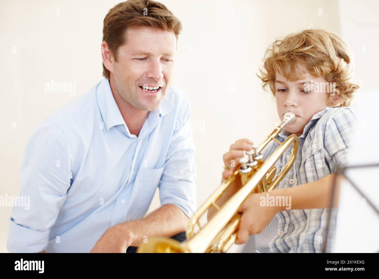 Playing, music and teacher and child with trumpet for practice, lesson ...