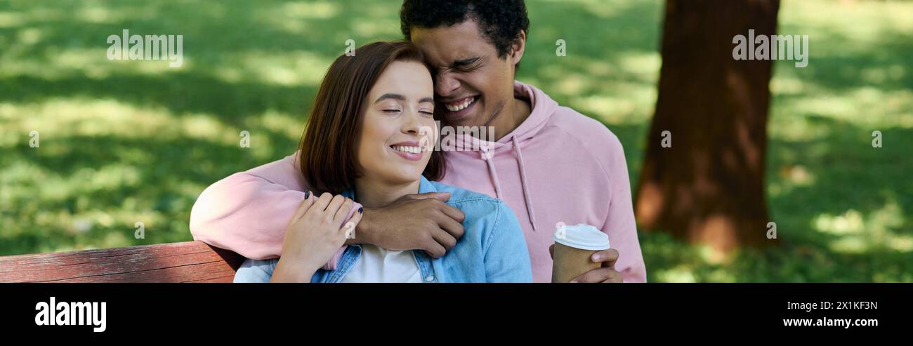 A diverse couple in vibrant attire sharing a loving embrace on a park ...