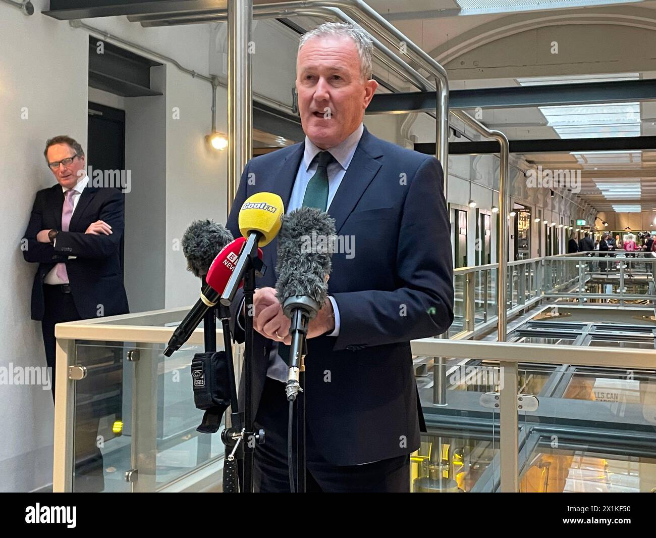 Stormont Economy Minister Conor Murphy speaks to the media at the ...