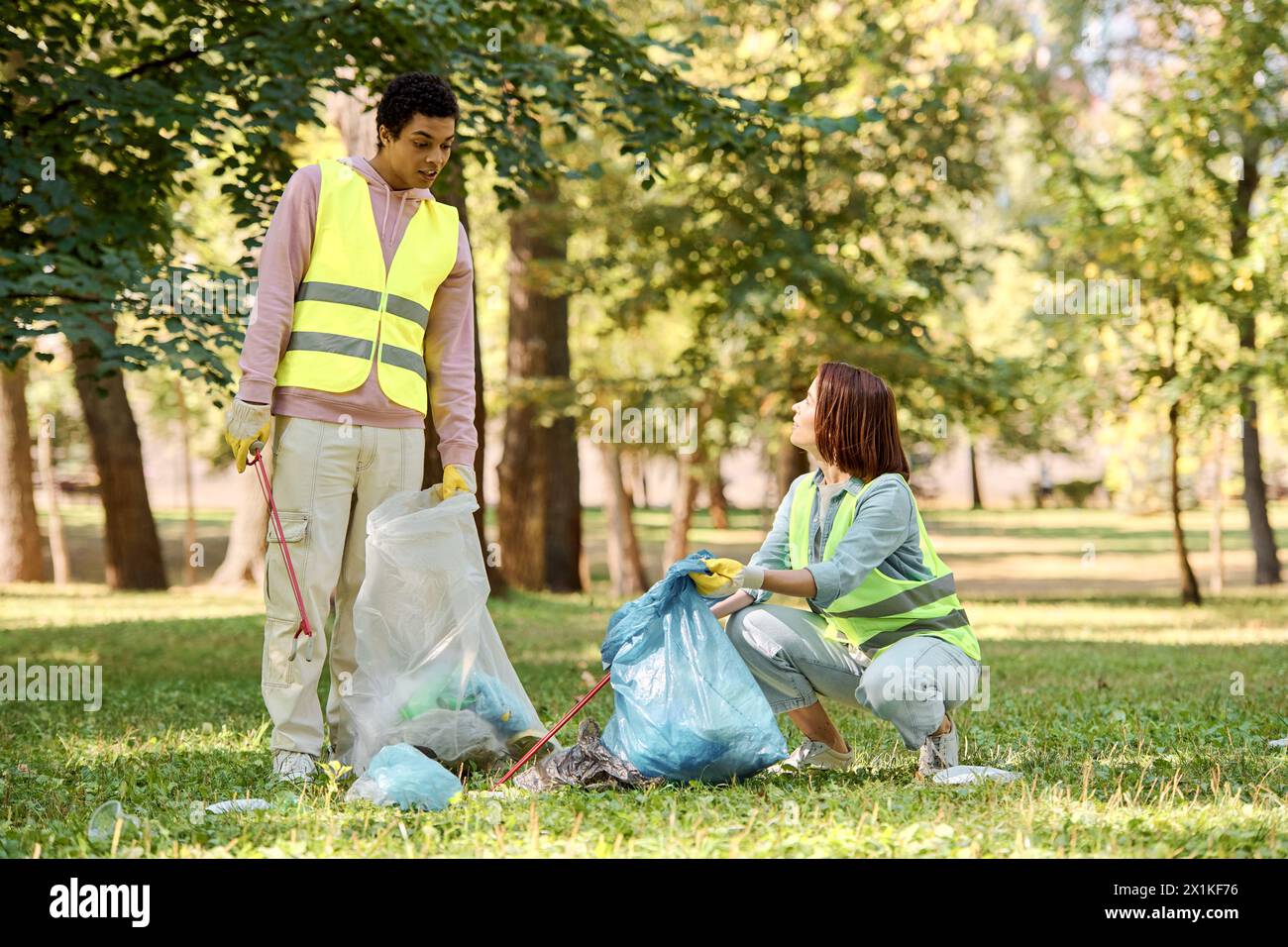 A socially active diverse loving couple in safety vests and gloves ...