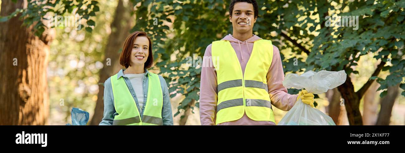 A socially active, diverse couple wearing safety vests and gloves ...