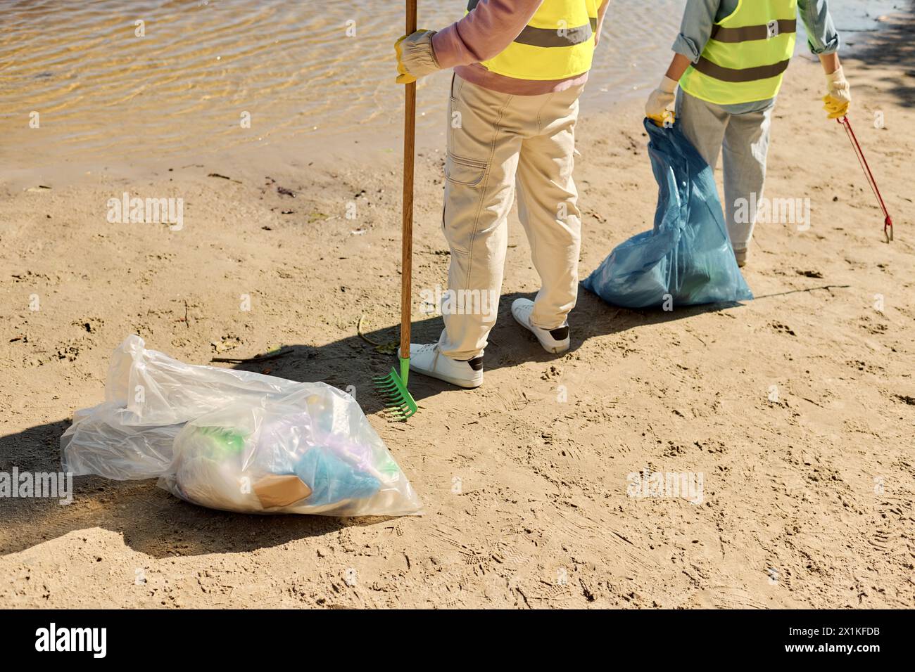 Interracial hard working couple passionately cleaning up a park while ...