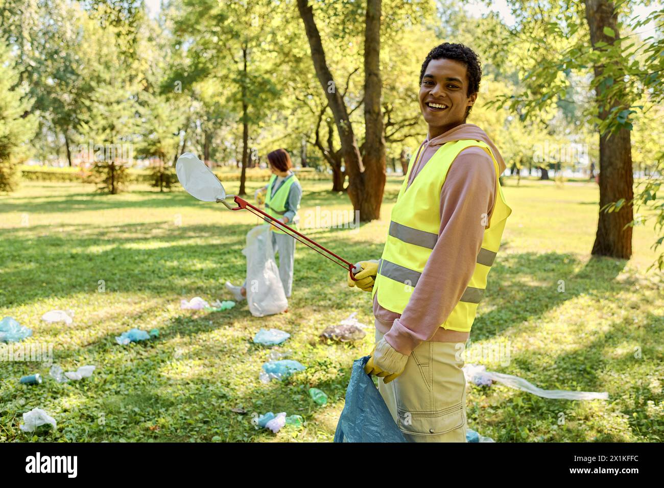 Socially active diverse loving couple in safety vests and gloves ...
