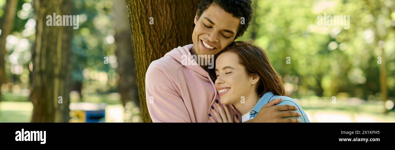 A diverse couple, dressed vibrantly, sharing a loving hug in a park ...
