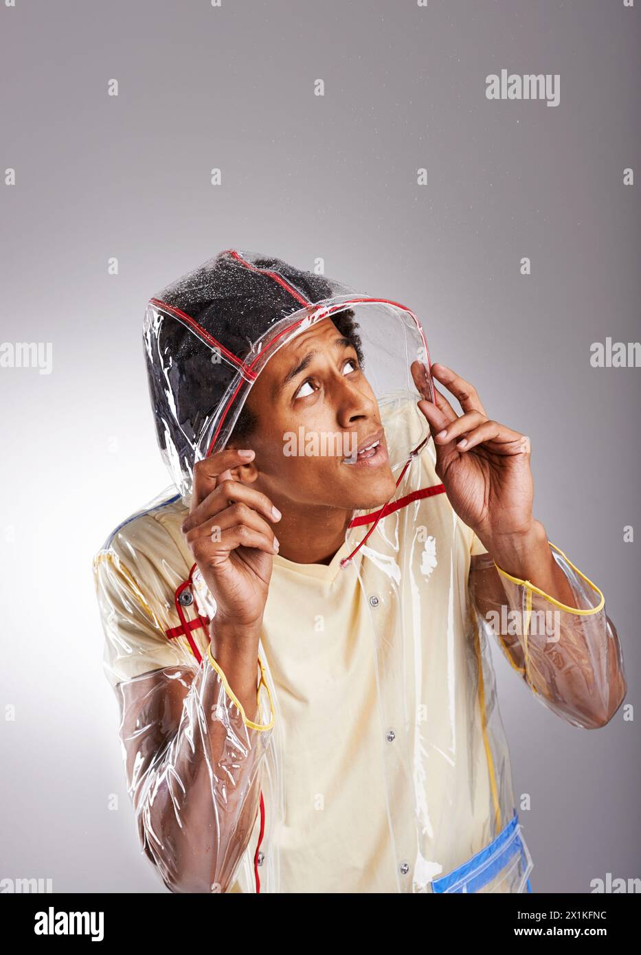 Man in transparent rain coat hi-res stock photography and images - Alamy