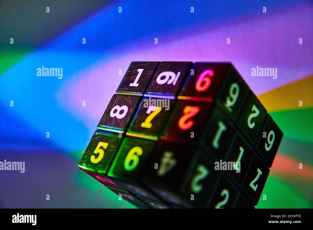Colorful Numeric Puzzle Cube with Rainbow Background Stock Photo - Alamy