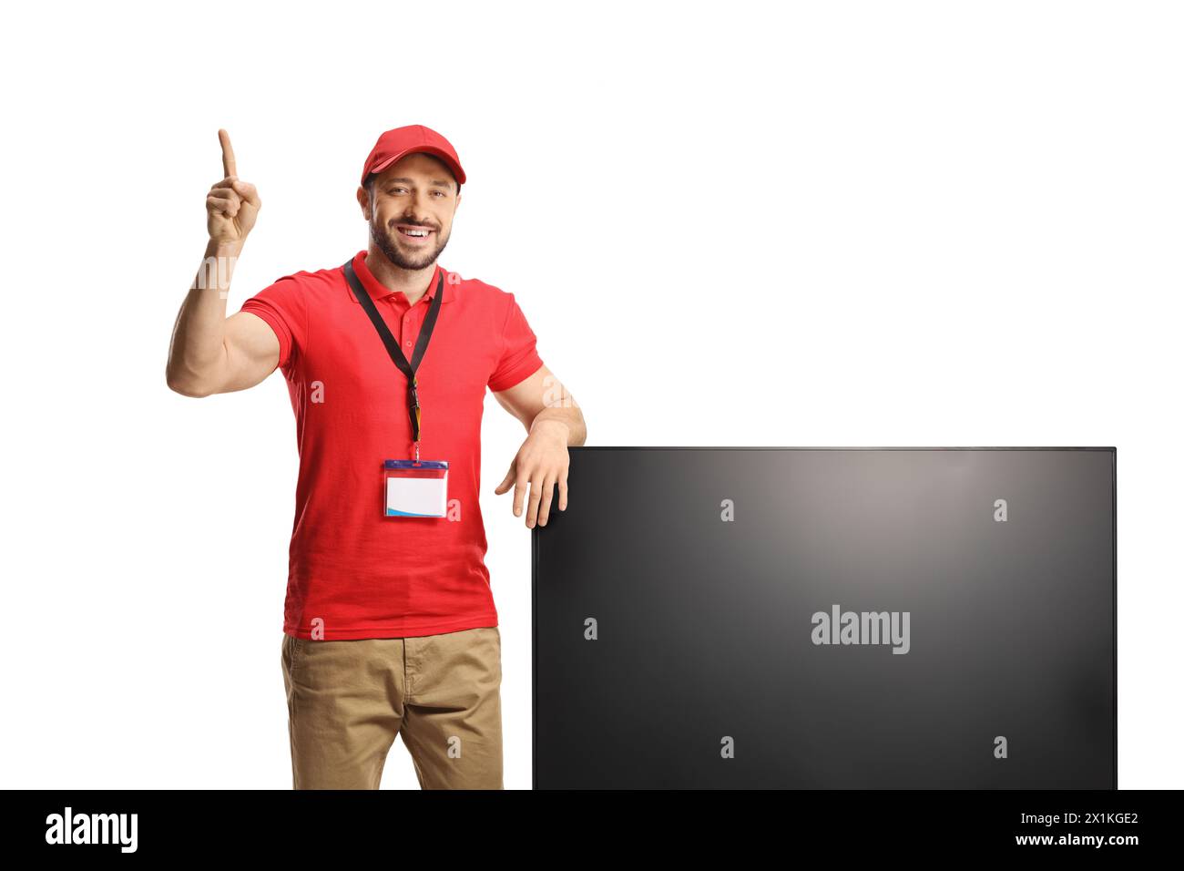 Salesman pointing up and leaning on a flat lcd tv screen isolated on ...