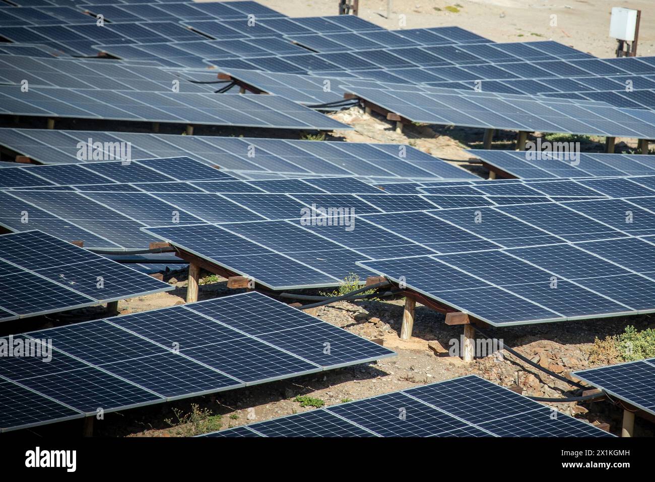 Solar panels laid out on the rocks in the port of Luderitz in Namibia ...