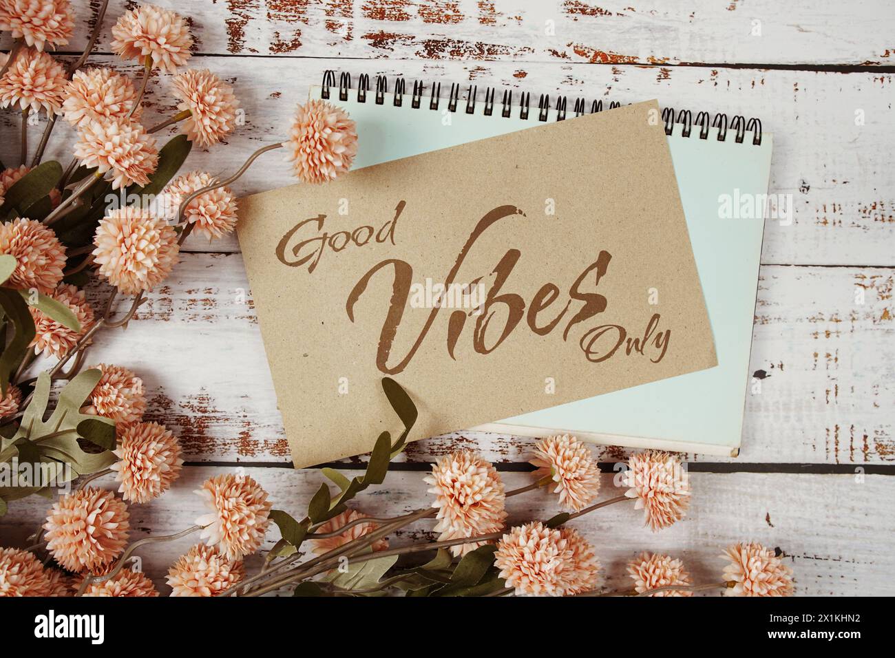 Good Vibes only text message on paper card with flowers border frame on ...