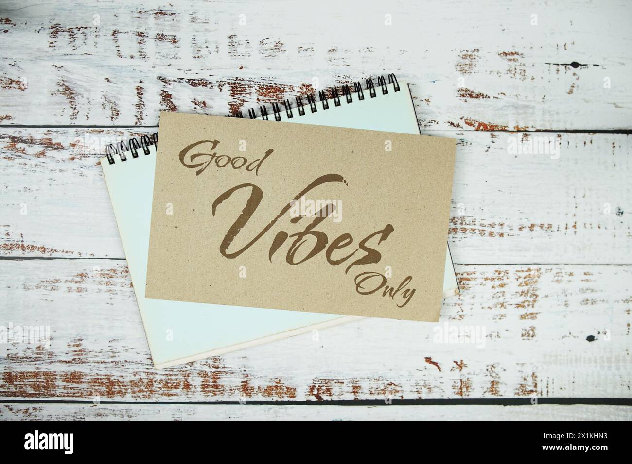 Good Vibes only text message on paper card with flowers border frame on ...