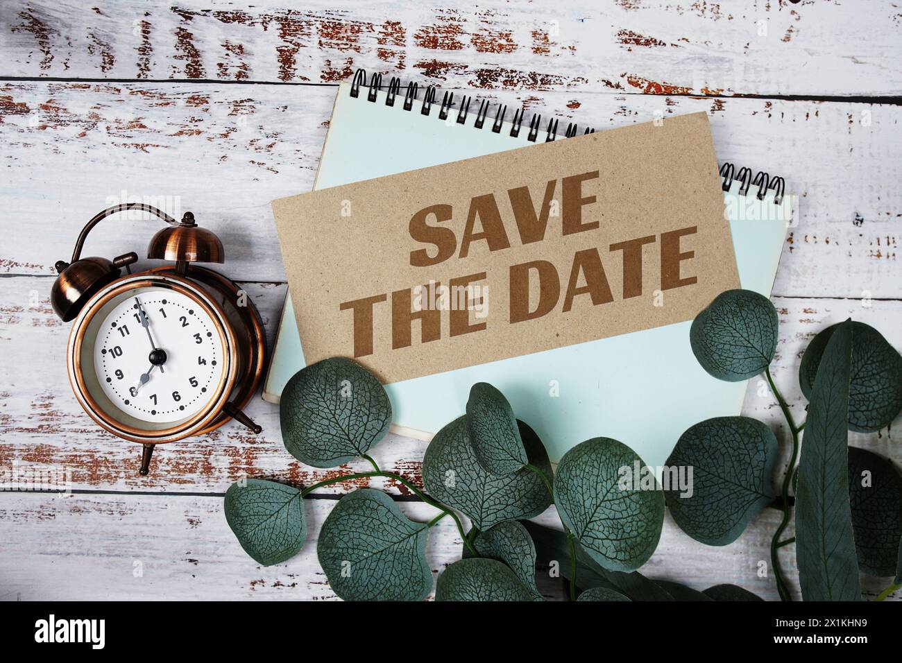 Save the Date text message on paper card with flowers border frame on ...