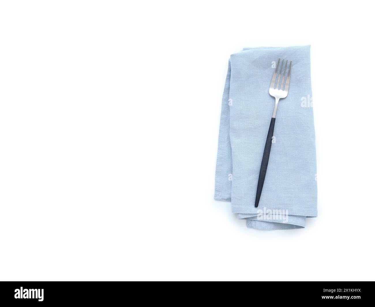 Top view blue linen kitchen napkin and cutlery isolated on white ...