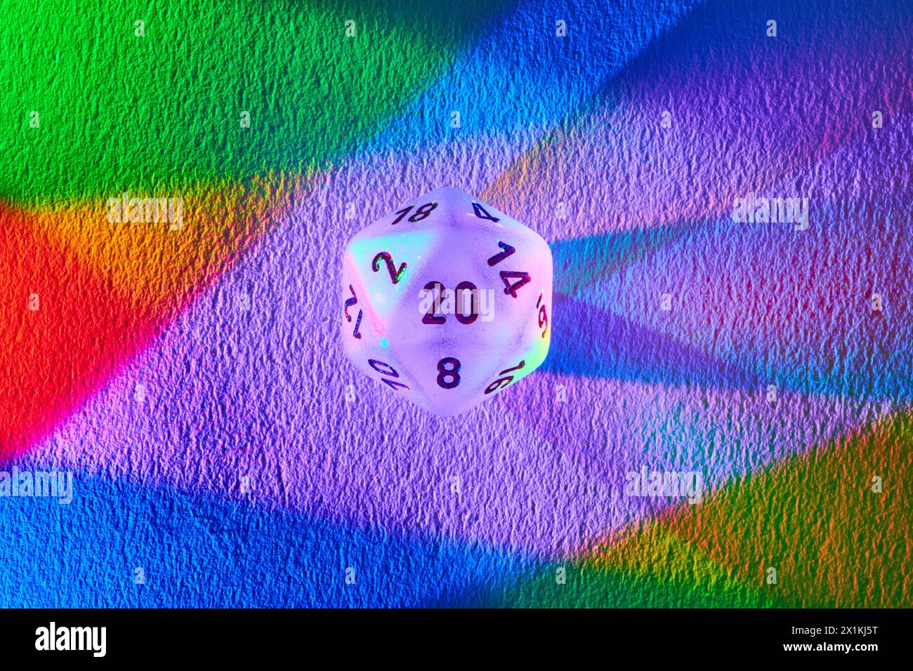 Colorful D20 Die on Rainbow Spectrum Background, Macro Perspective ...