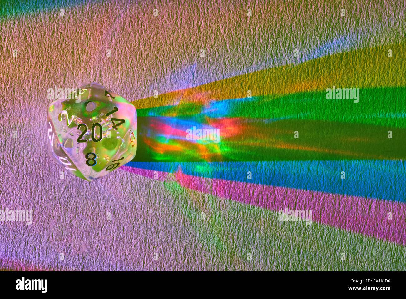 Critical Roll Rainbow Prism Die on Textured Surface Stock Photo - Alamy