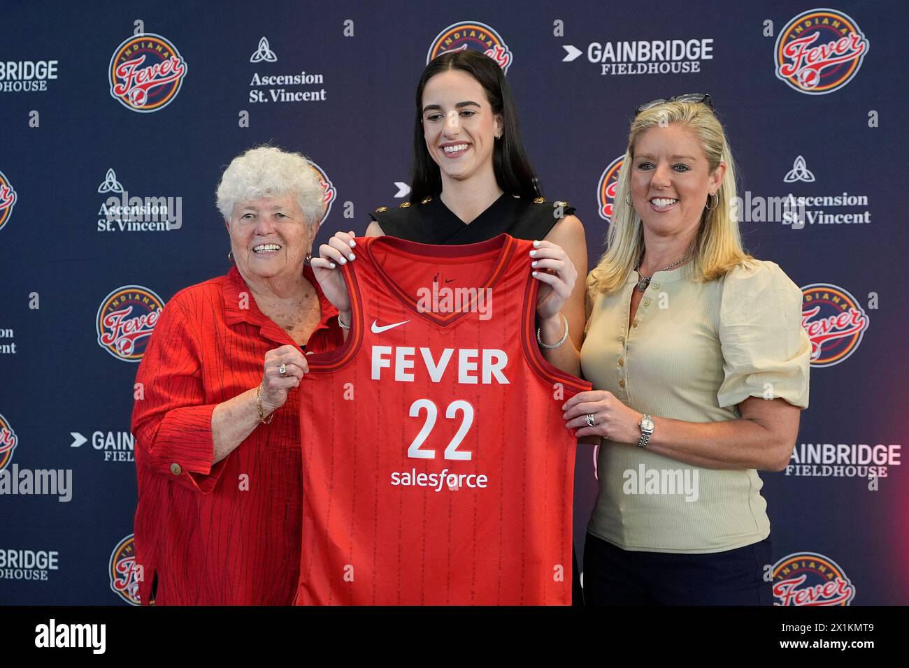 Indiana Fever's Caitlin Clark, middle, poses with general manager Lin ...