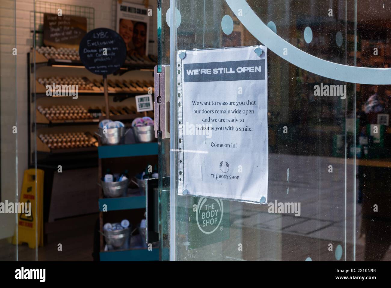 Notice on window of The Body Shop branch informing customers that they ...