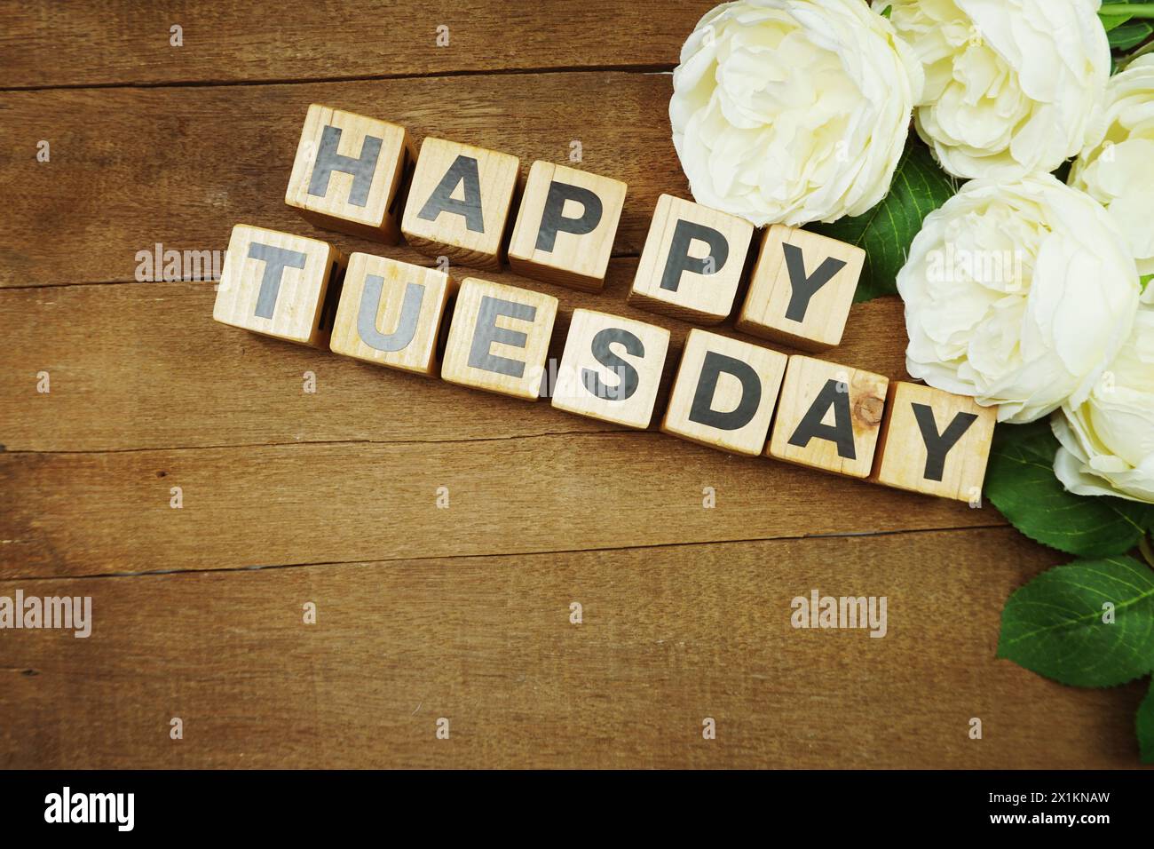Hello Tuesday alphabet letters on wooden background Stock Photo - Alamy