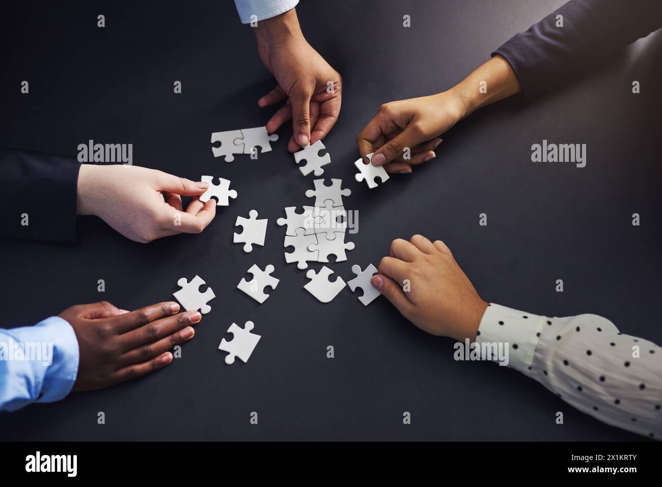 Hands, puzzle and business people with teamwork, planning and ...