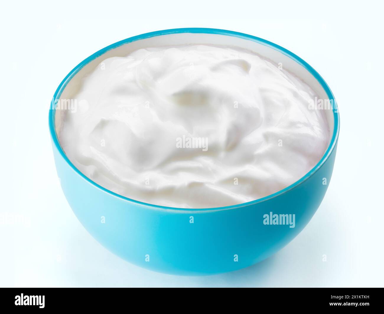 cream sour in blue bowl isolated white background Stock Photo - Alamy
