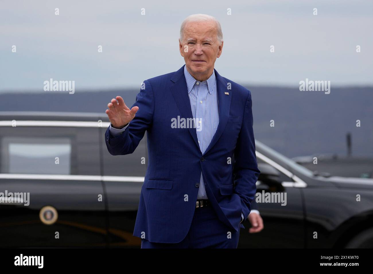 President Joe Biden waves as he arrives to depart on Air Force One at ...