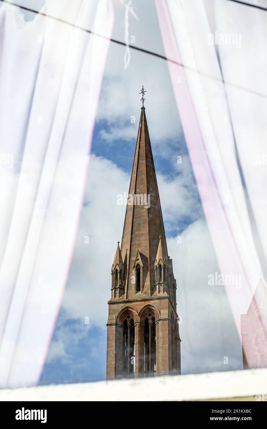 Reflection of a church steeple in a house window Stock Photo - Alamy