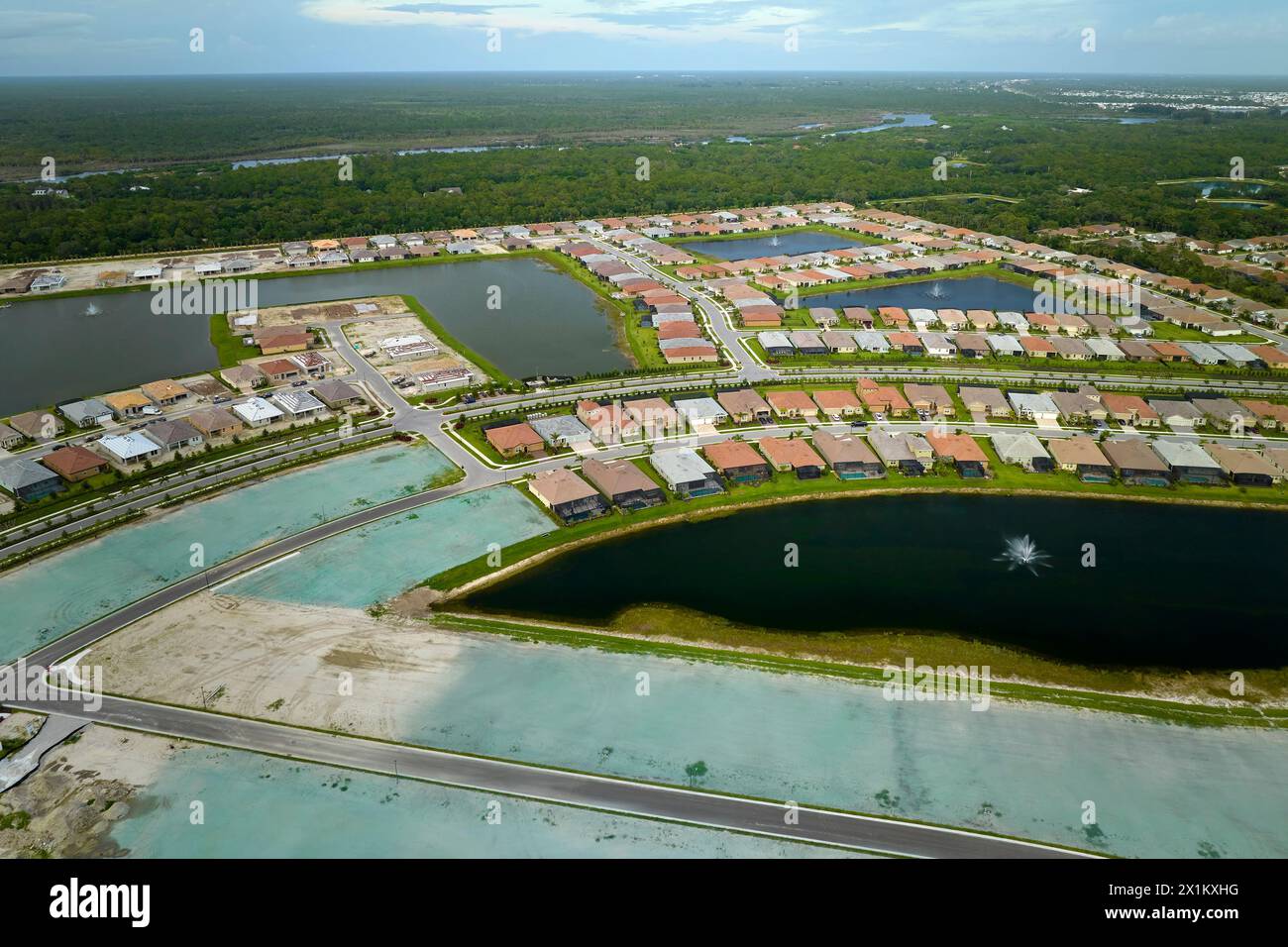 Aerial view of construction site with new tightly packed homes in ...