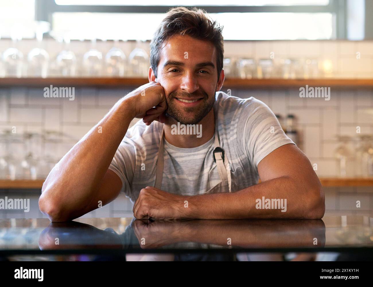 Portrait, waiter and smile of man in restaurant, cafe or small business ...