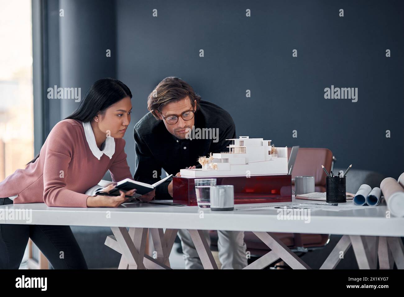 Architect, teamwork and modern house model for construction, people and ...