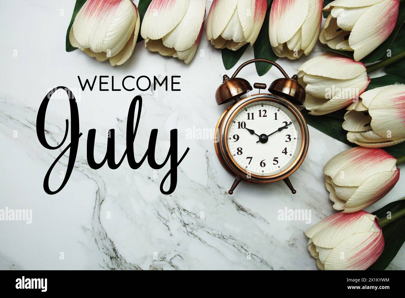 Welcome July text with alarm clock and tulip flower bouquet on marble ...