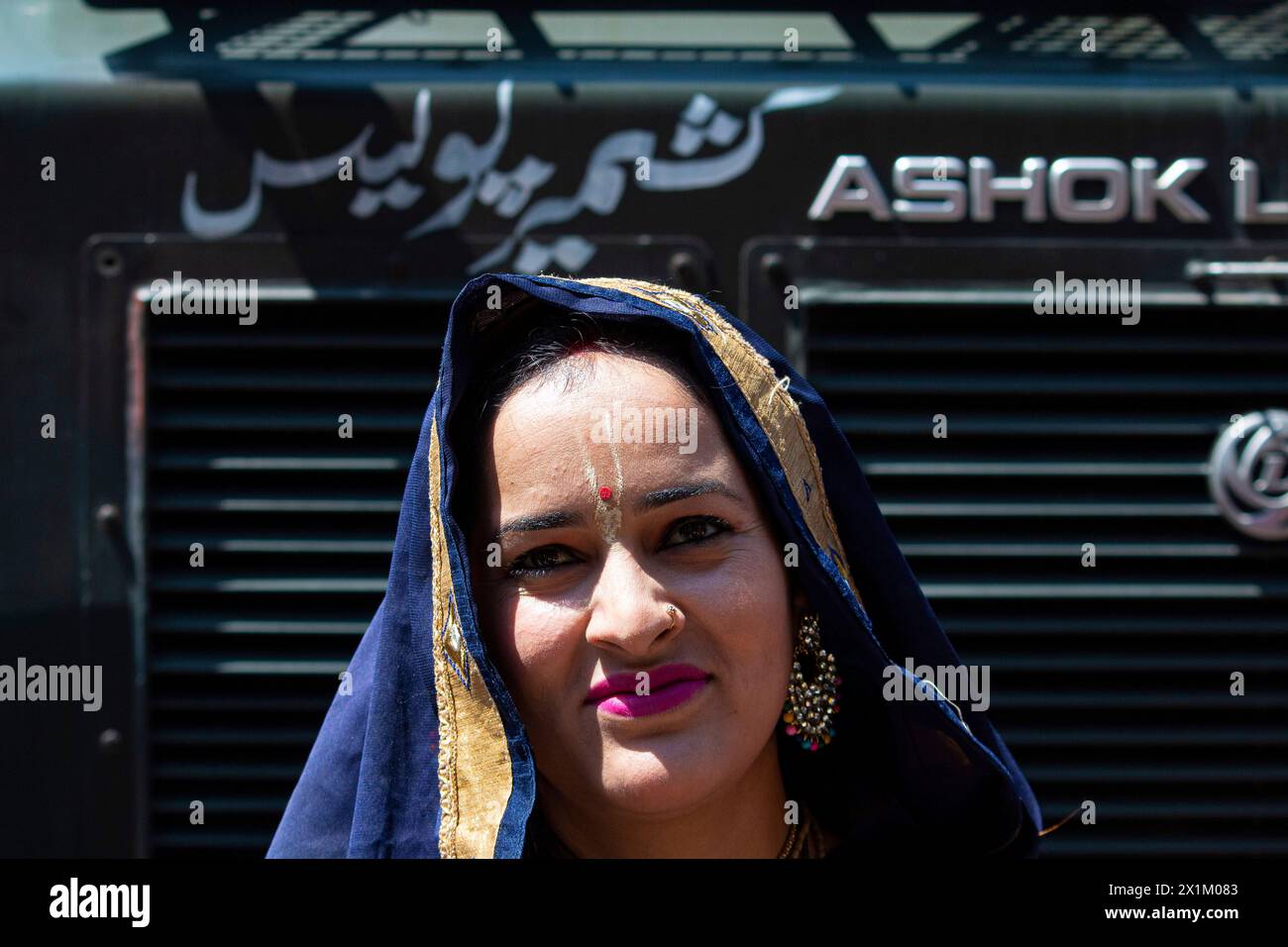 Srinagar, India. 17th Apr, 2024. A Hindu woman takes part in a ...