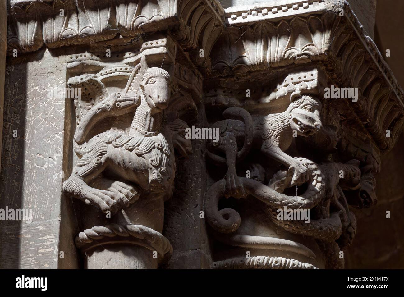 A lion fighting with a snake - Medieval Bestiary - Capital (12th ...