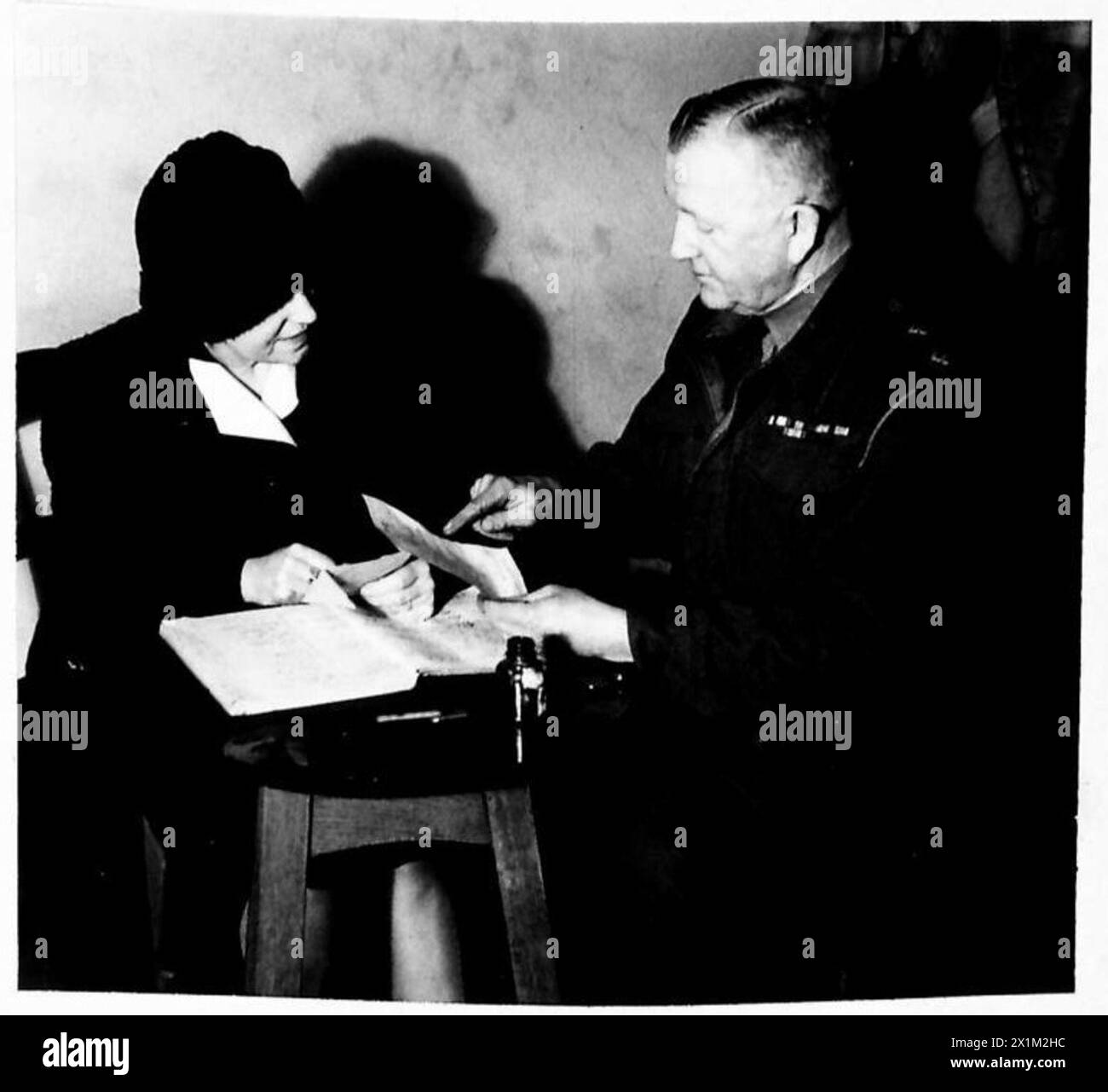 The Casualty and Public Relations Officer consults with Mrs. Cartwright ...