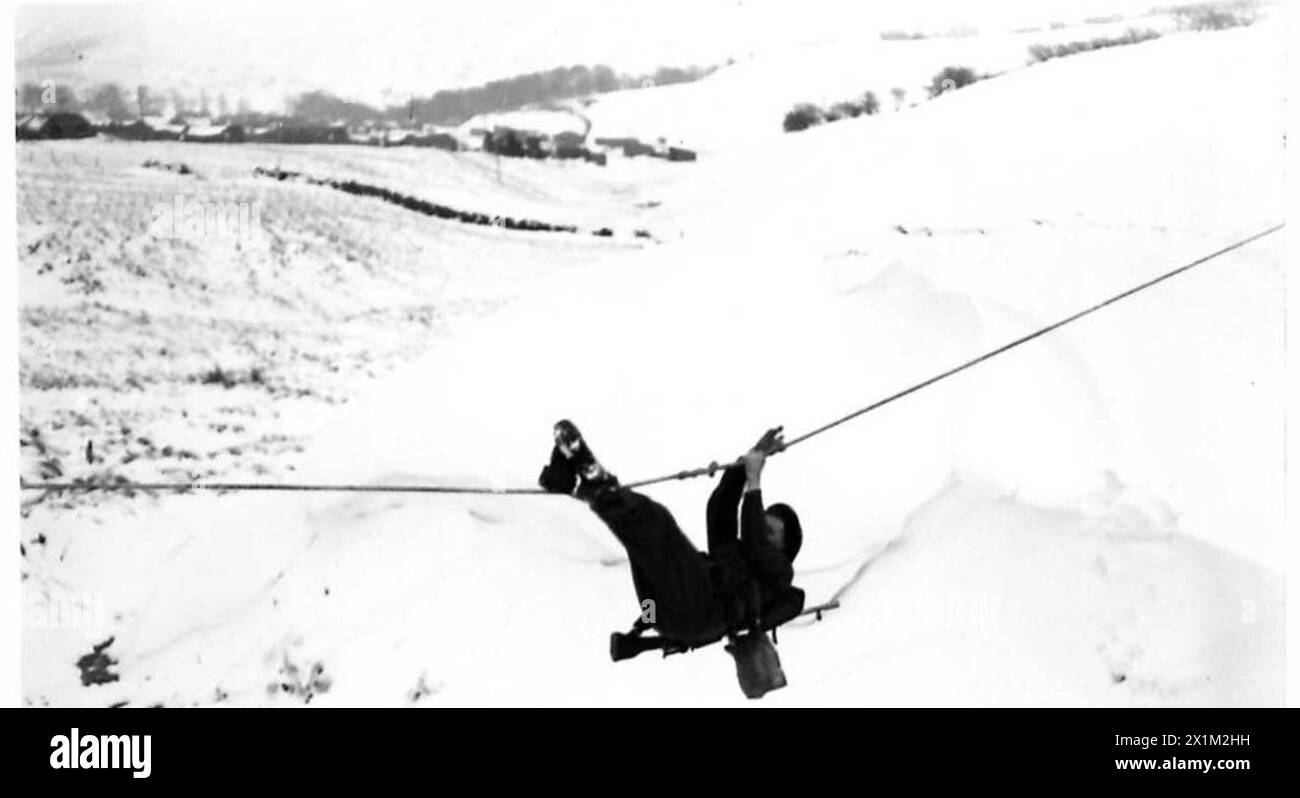Royal Marines train in snow conditions, learning to cross streams using ...