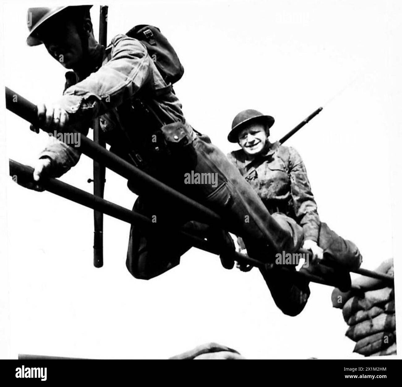 TRAINING RASC OFFICERS - Cadets crossing an improvised bridge in their ...