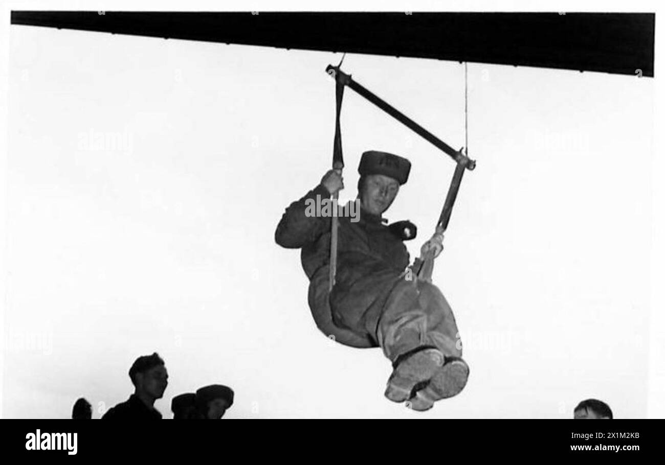 PARATROOPS IN TRAINING - By means of swings, paratroop recruits are ...