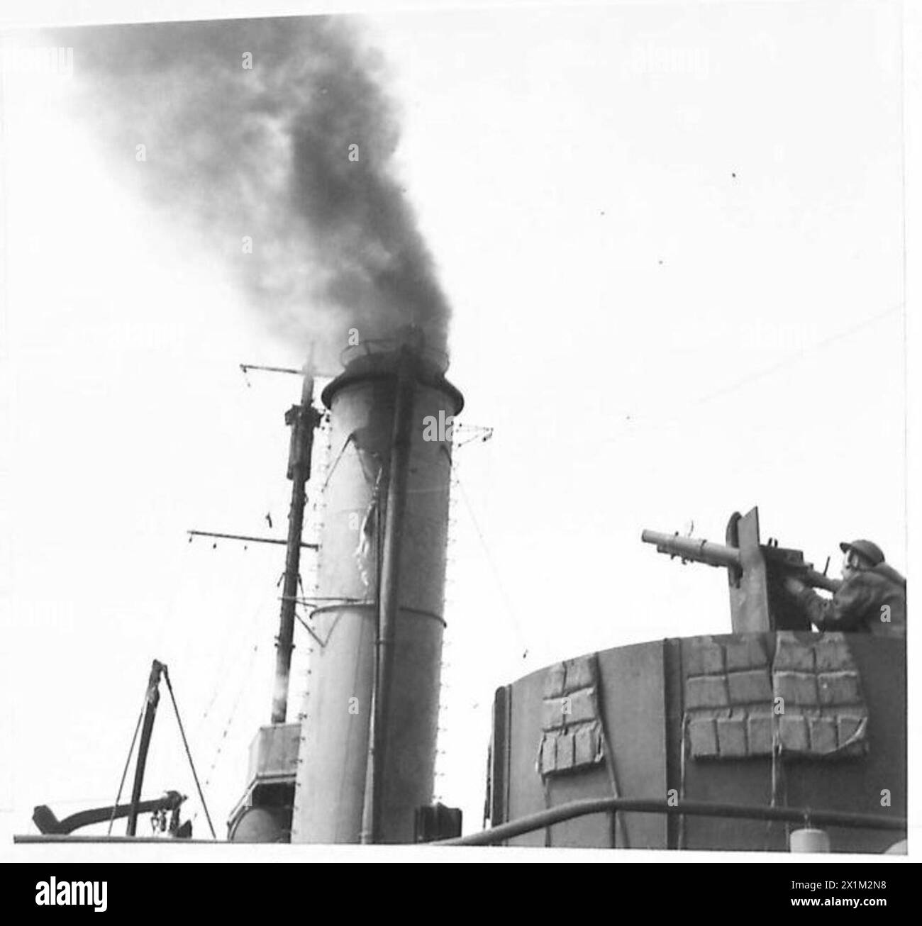MISCELLANEOUS - A Lewis gunner at his post on board a trawler, British ...