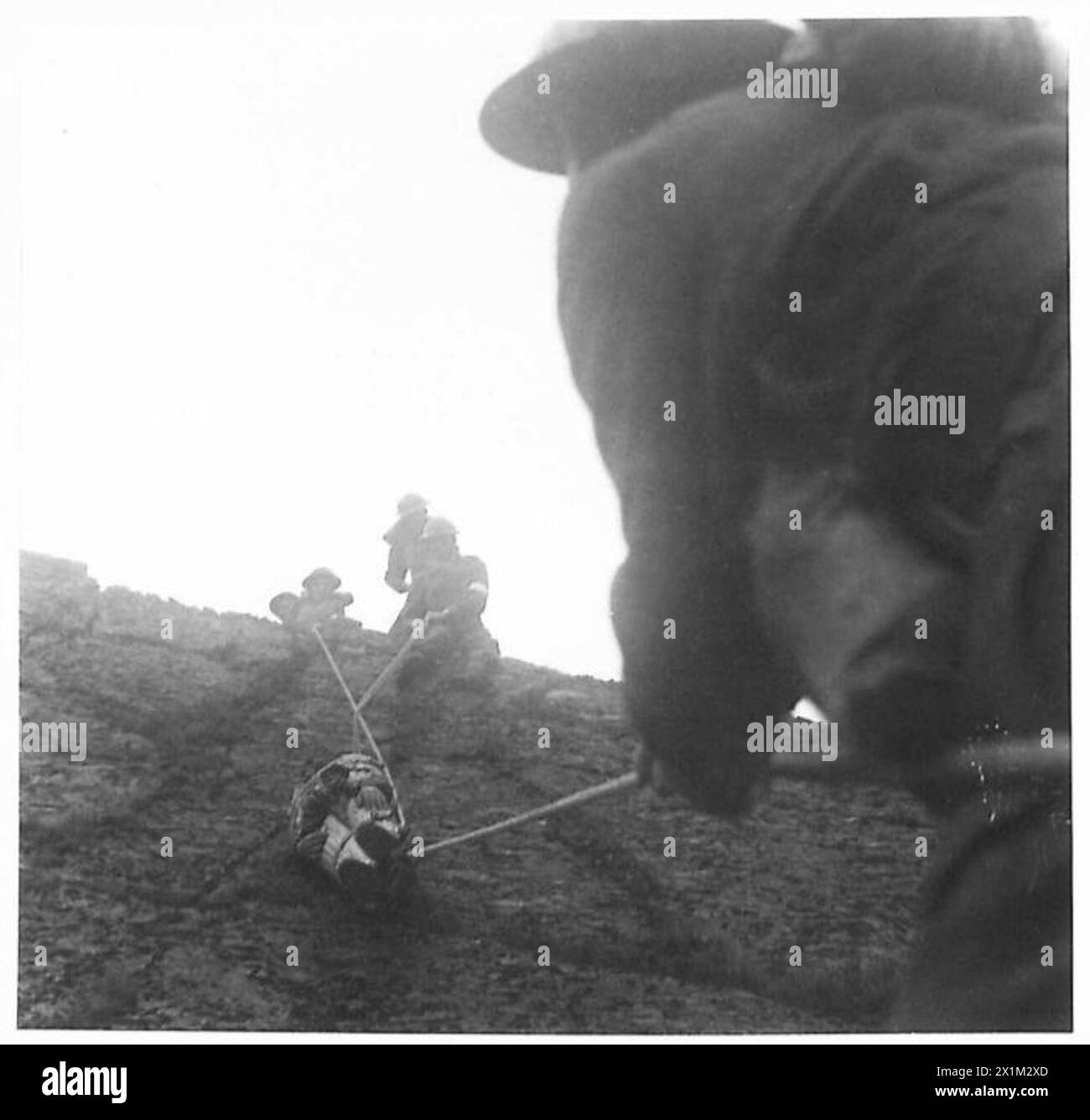 ROYAL ARMY MEDICAL CORPS EXERCISE - A"casualty" being lowered down a ...